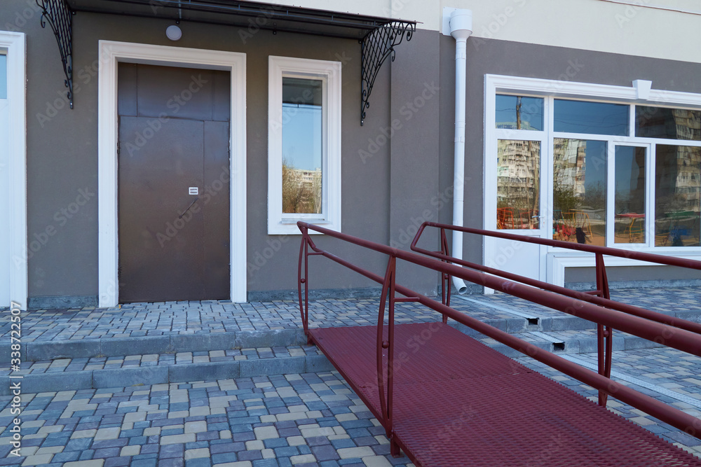 Wheelchair access ramp for entrance of residential multistory building ...