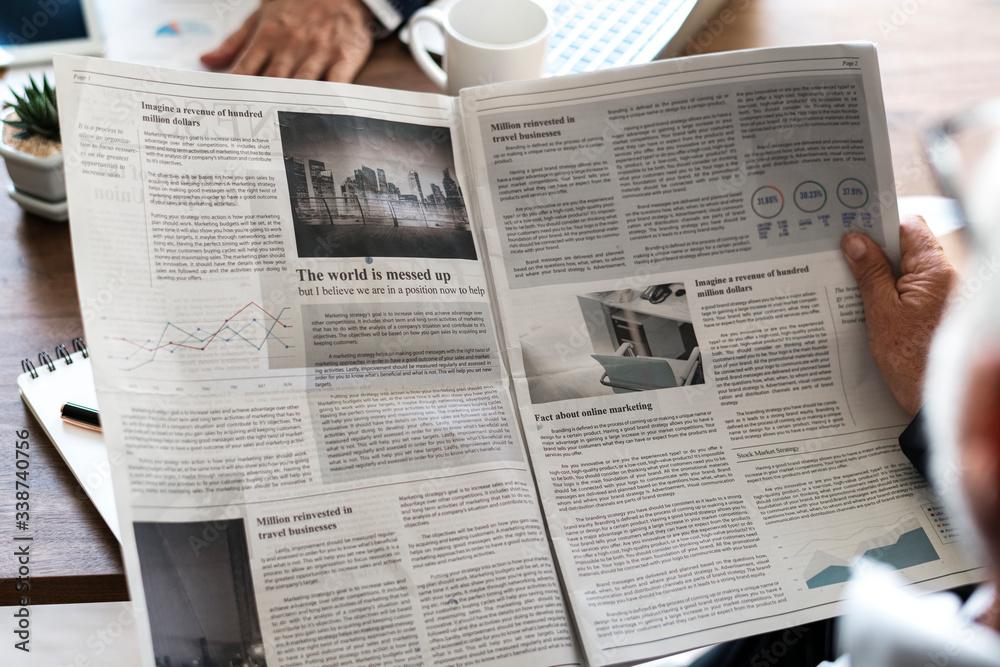 Business people reading newspaper Stock Photo | Adobe Stock