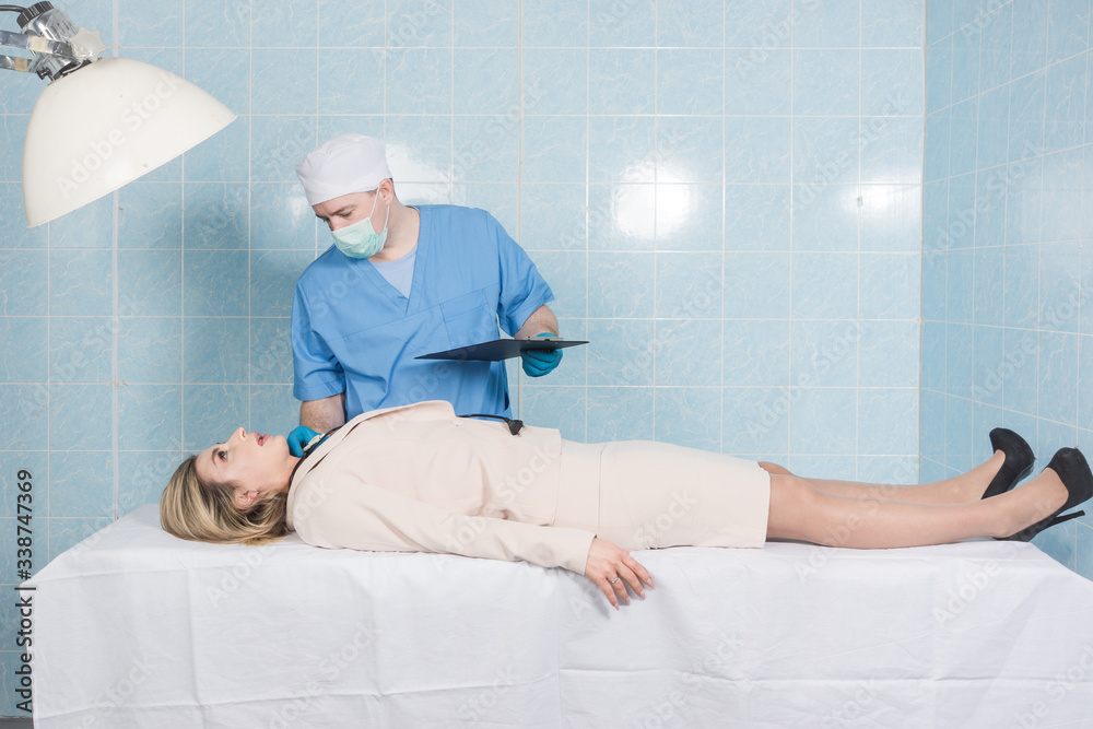 Coroner inspects the body of the crime victim (imitation).. Stock Photo ...