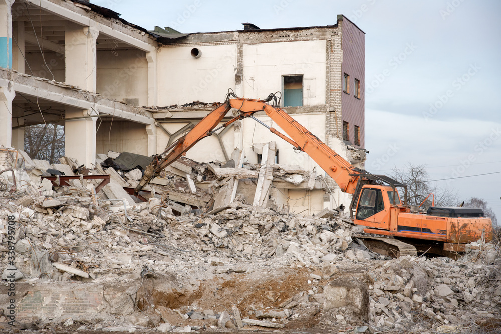 High Reach Excavator machines for demolition of tall building. Machine ...