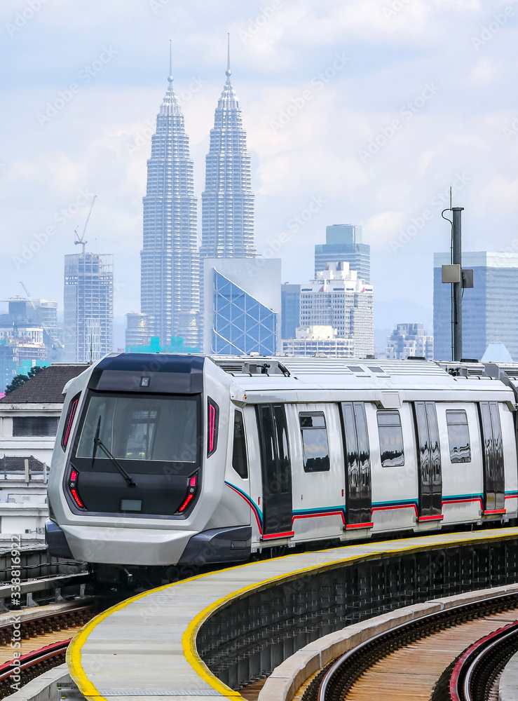 Malaysia Mass Rapid Transit (MRT) train with a background of Kuala ...
