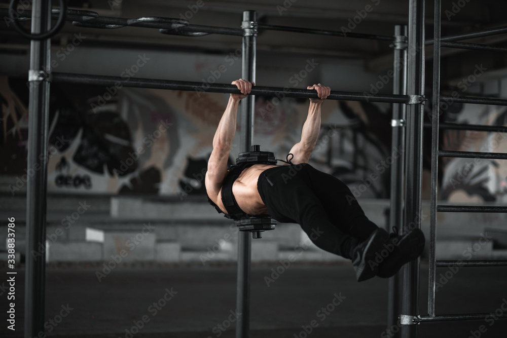 Man during workout in the gym Concept: power, strength, healthy ...
