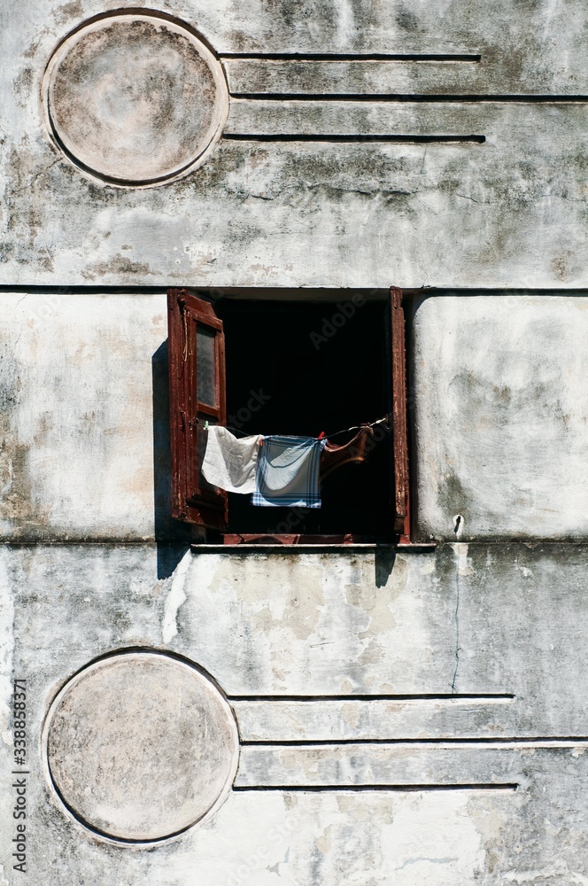 Clothes Drying On Window Pane Stock Photo | Adobe Stock