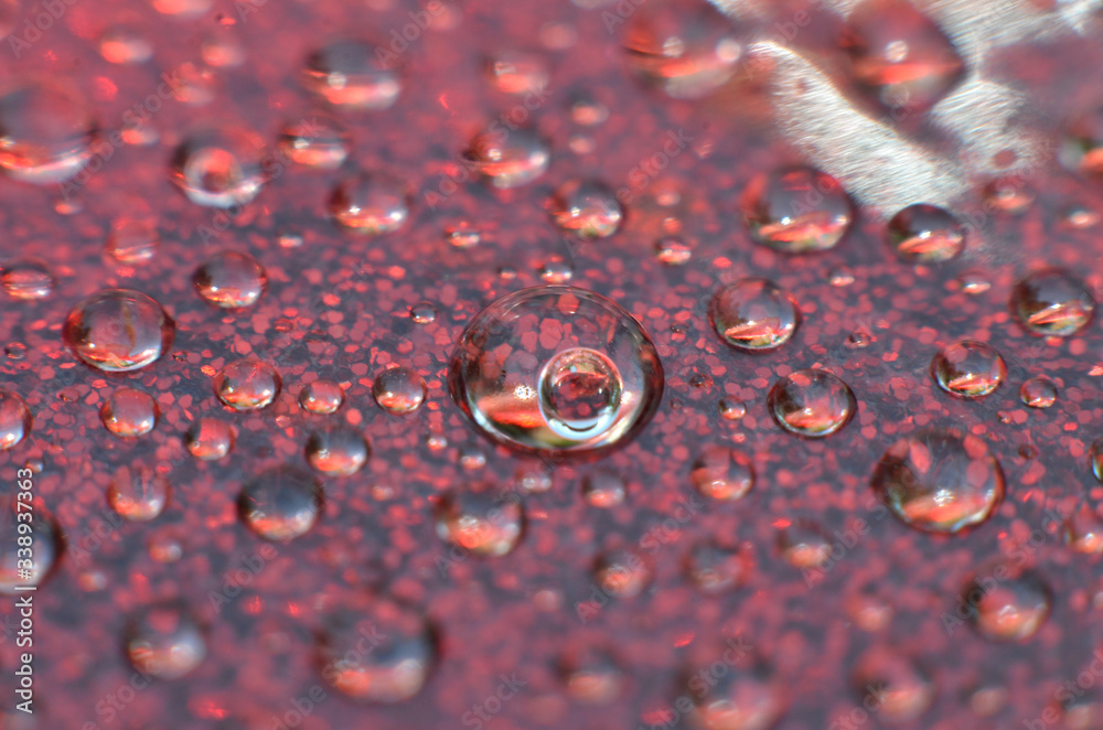 shiny clear water point attached to a glass reflects the same color as ...