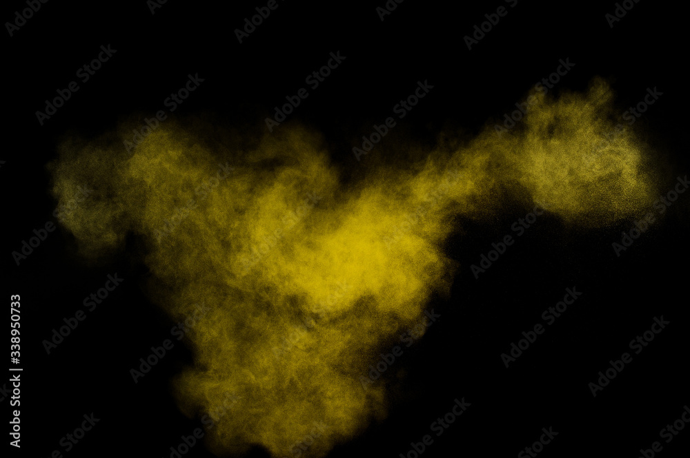 Yellow powder explosion.Yellow powder explosion on black background ...