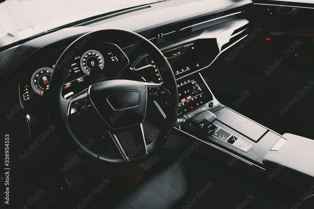 Interior of an ultra modern new luxury car. Leather chairs and wood ...