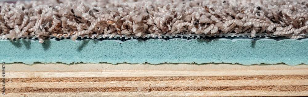Foto de Carpet, padding, and plywood layers for installation of ...