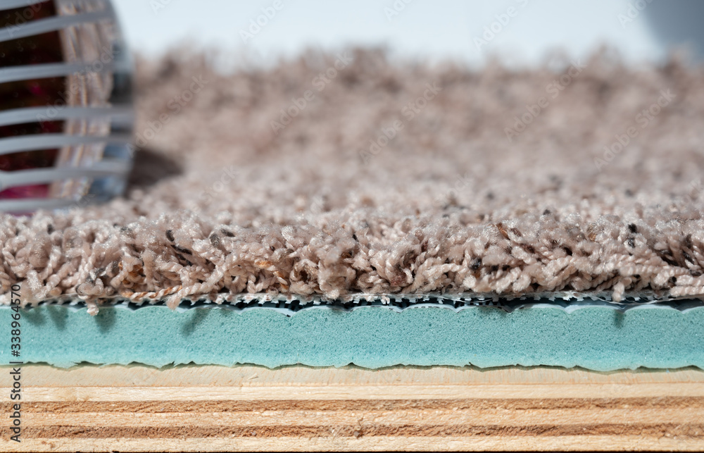 Carpet, padding, and plywood layers for installation of flooring Stock ...
