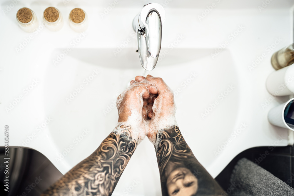 Antiseptic hand washing procedure with soap and water in bathroom ...