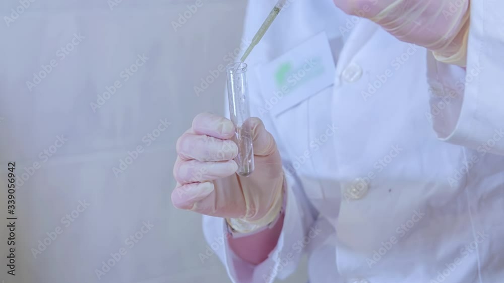 Laboratory analysis with pipette and liquid to find vaccine for covid ...