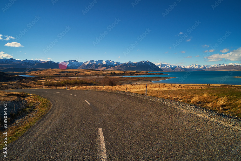 Driving on a wild open road from Mt St John Observatory, with a view of ...