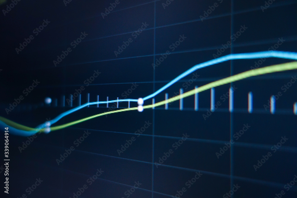 Stock market trading graph and candlestick chart on screen monitor ...