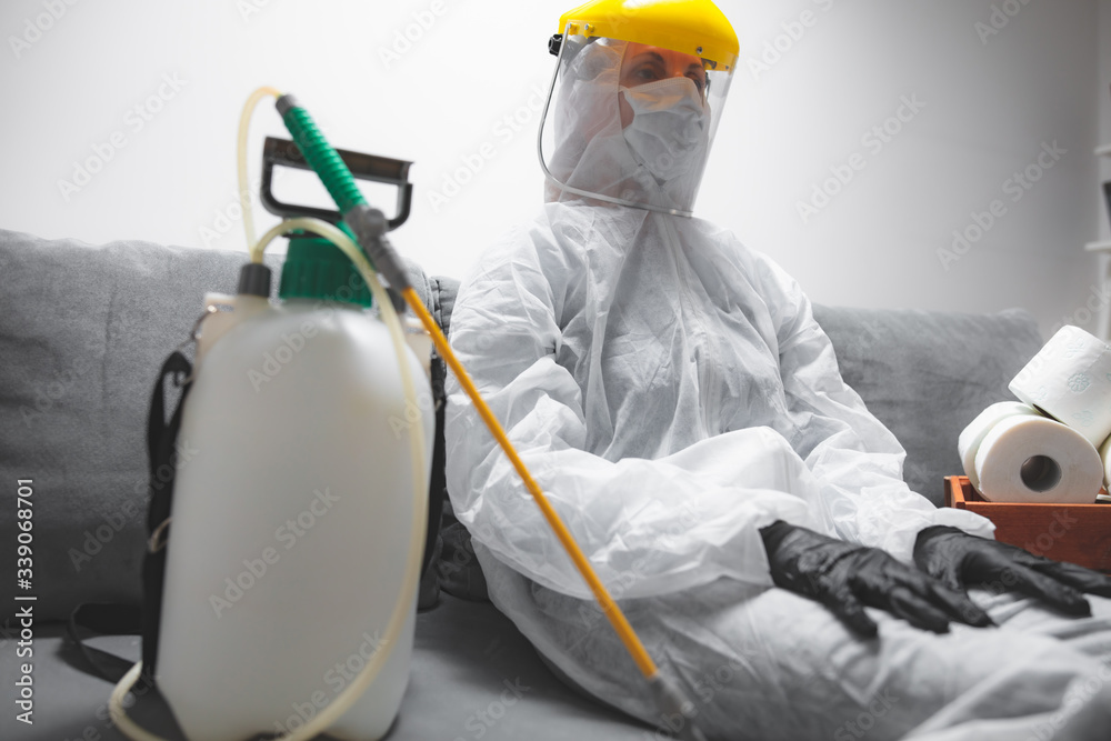 Person with toilet paper stock and protective antiviral mask, suit ...