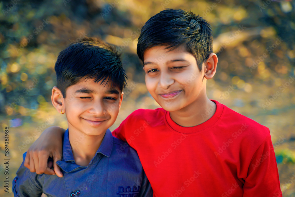 two young indian child wink his eye Stock Photo | Adobe Stock