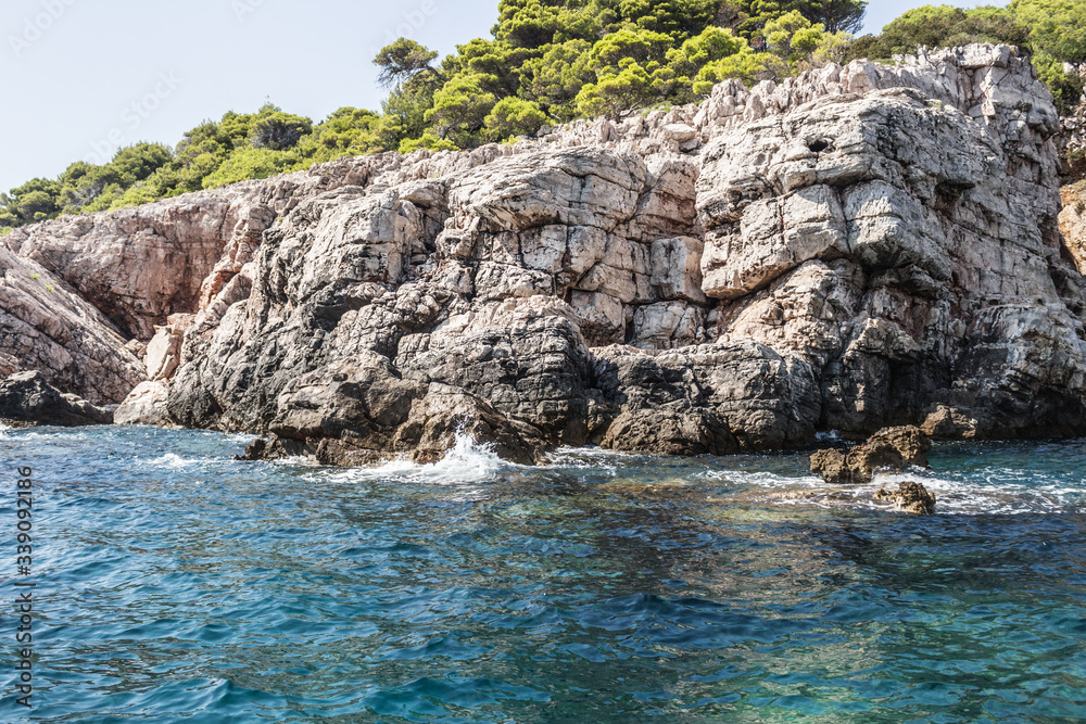 Dubrovnik sea view with the cliff and rocks sea water splashing on the ...