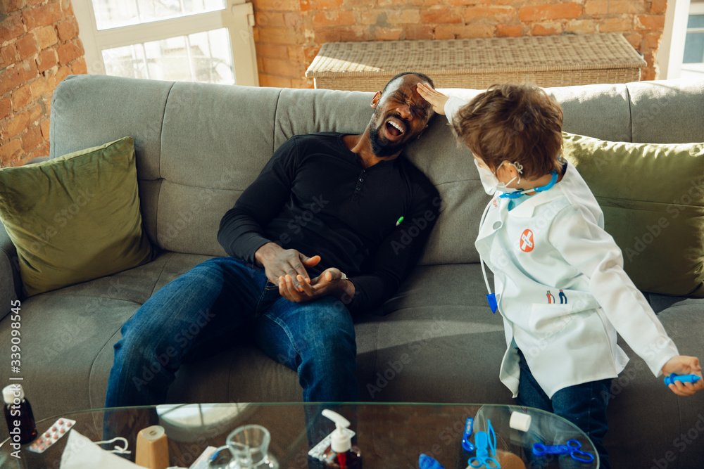 Caucasian teenboy as a doctor consulting for patient at home, giving ...