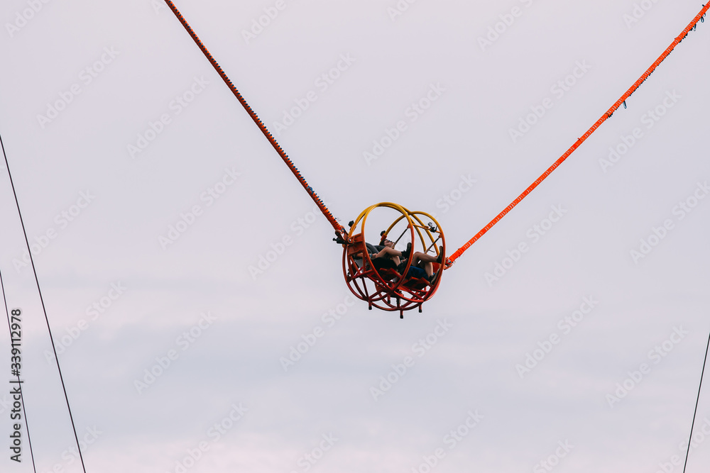People having fun on a reversed bungee, also called slingshot ride ...