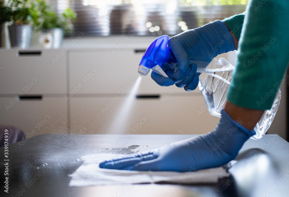 surface home cleaning spraying antibacterial sanitizing spray bottle disinfecting against COVID ...