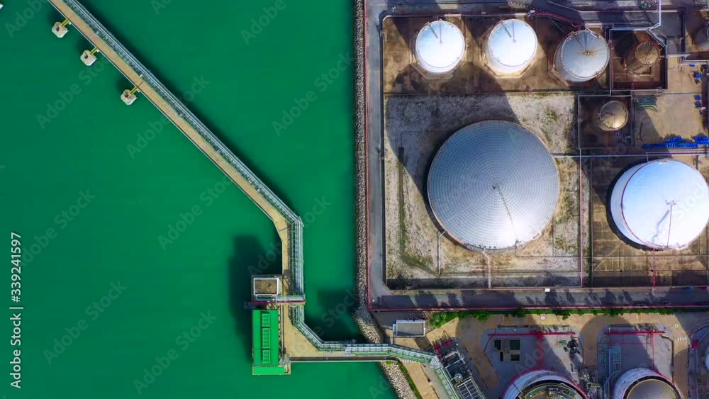 Aerial view oil treminal with storage tank farm, offshore oilrig ...
