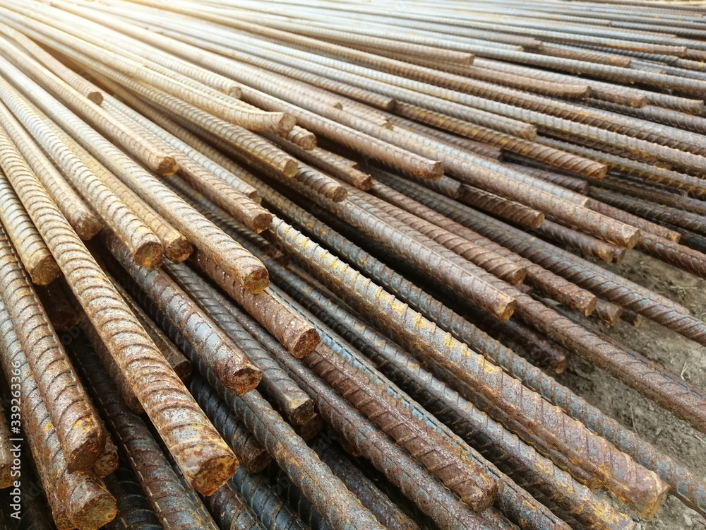 Steel rods or bars used to reinforce concrete. Deformed steel ...
