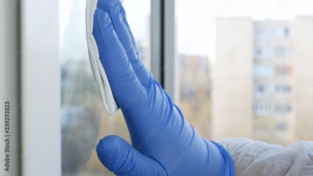 Close Up Man Hands with Protection Gloves Cleaning a Window Using ...