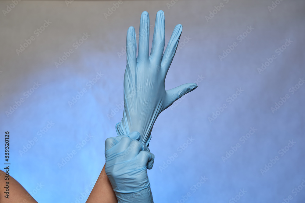 Human hands in blue disposable latex glove, rubber glove for hygiene ...