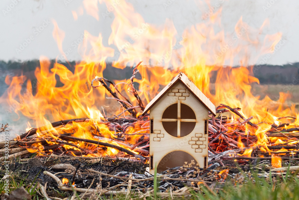 Wooden house or barn burning on fire. Dry grass is burning. Background ...
