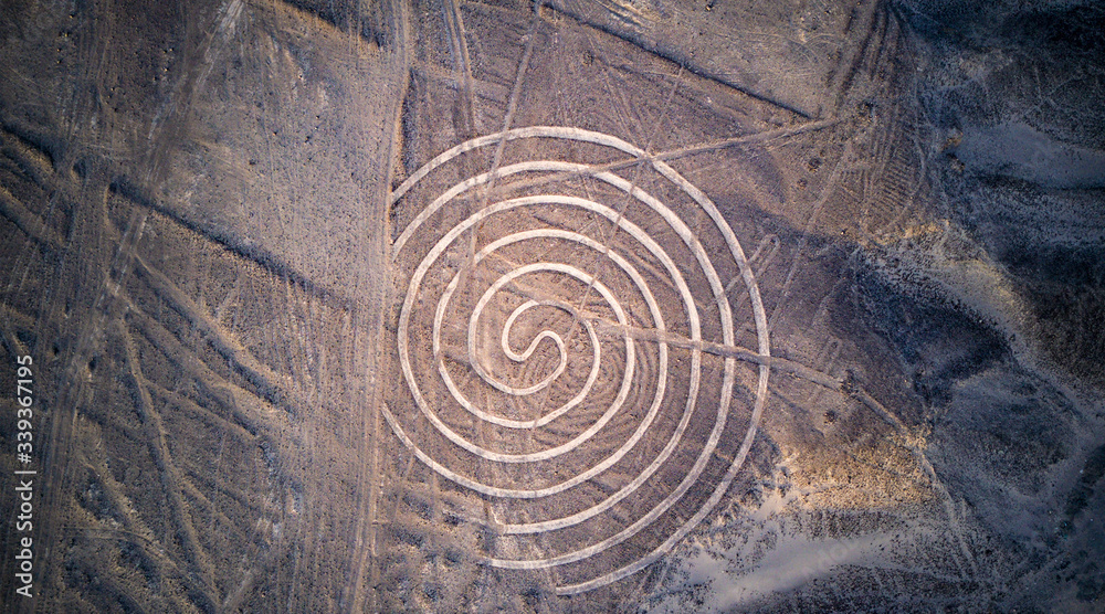 Aerial top down view on "the Circle" one of the Nazca lines. Mysterious ...