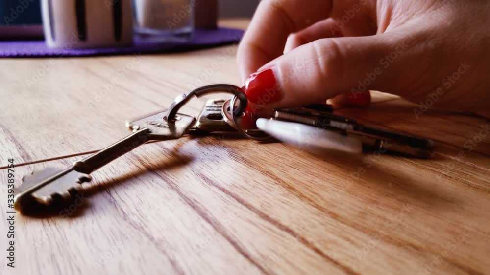 Woman Grabbing Keys from Wood Table at Home. Close-Up. Stock ビデオ ...