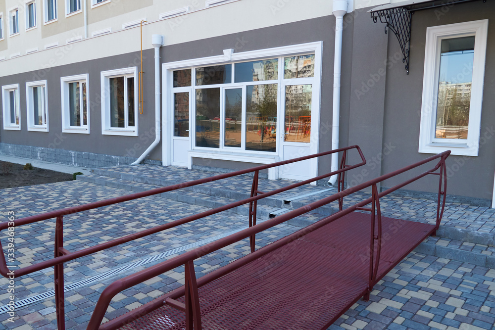 Wheelchair access ramp for entrance of residential multistory building ...