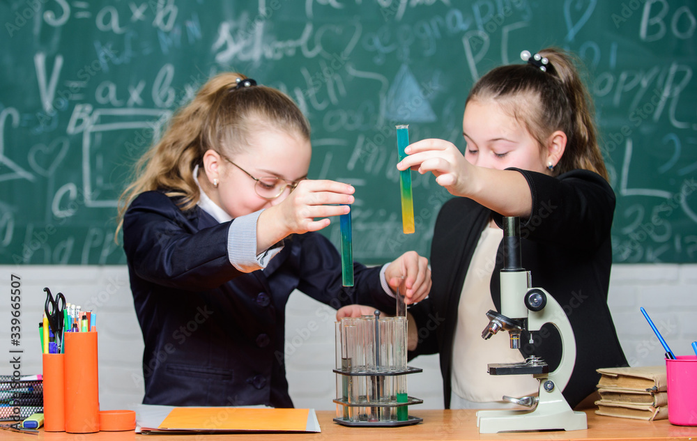 Little scientist teamwork with microscope. Chemistry research in ...