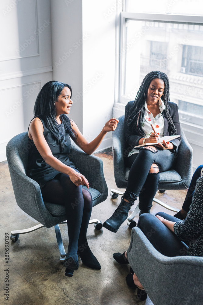 Professional businesswomen talking Stock Photo | Adobe Stock