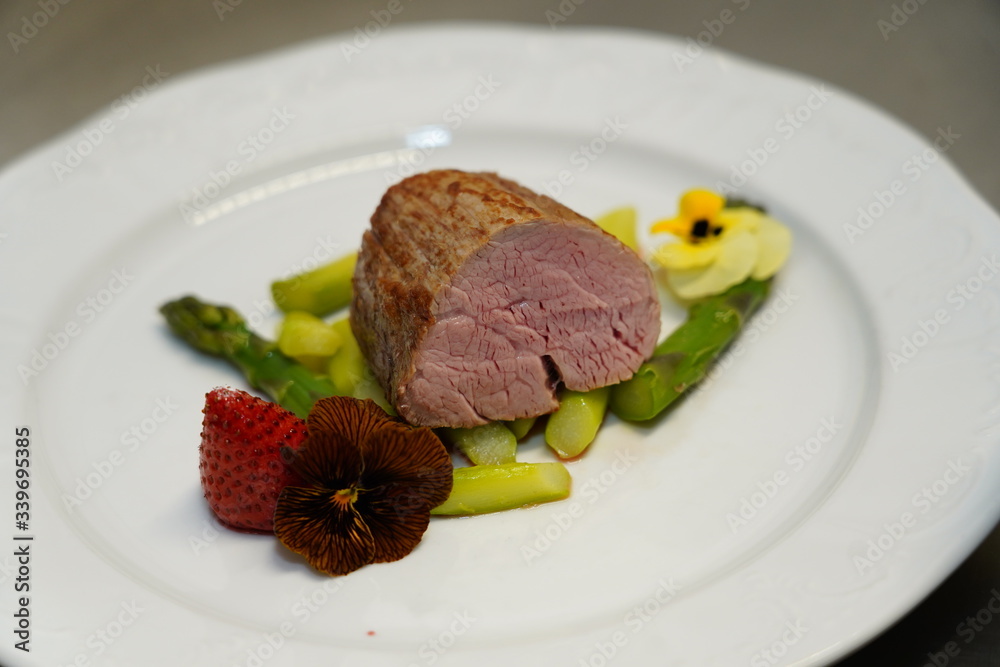 Beef fillet with gravy and vegetables. Fillet of mignon with spring ...