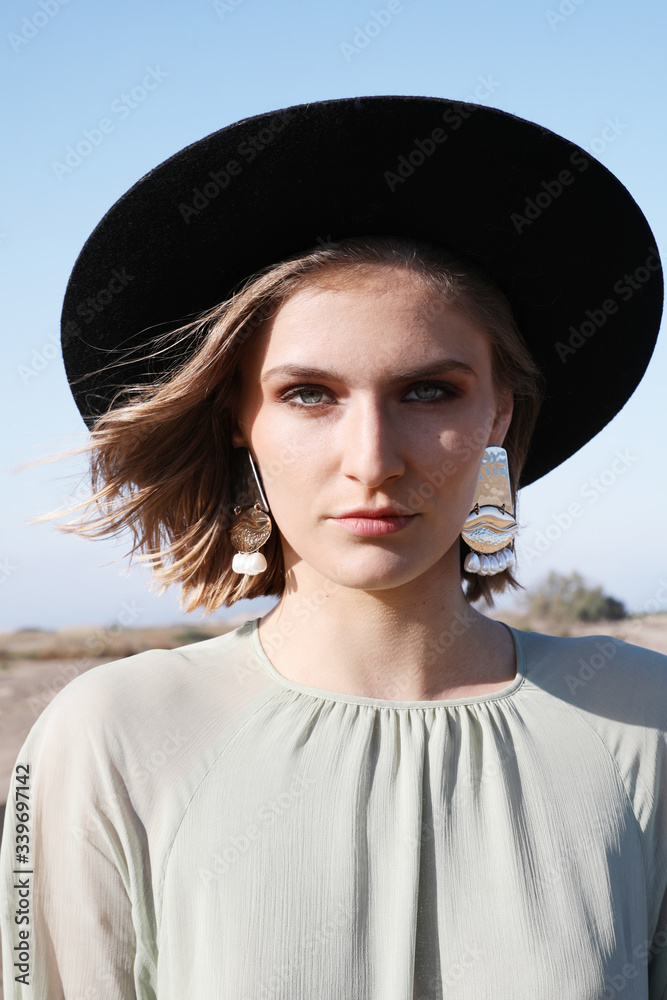 Vertical image of good looking female model posing on nature wearing ...