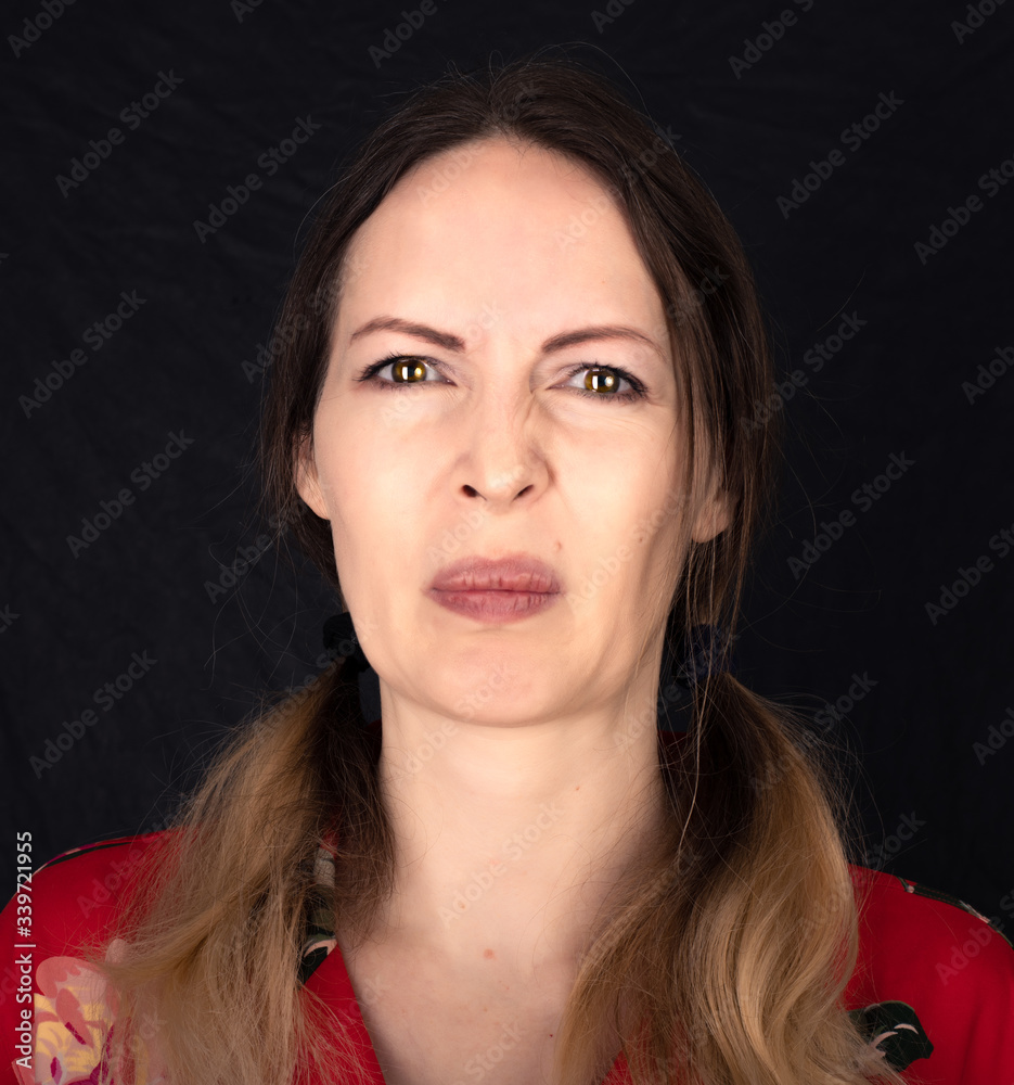 Emotion. Closed woman face with facial expressions over black ...