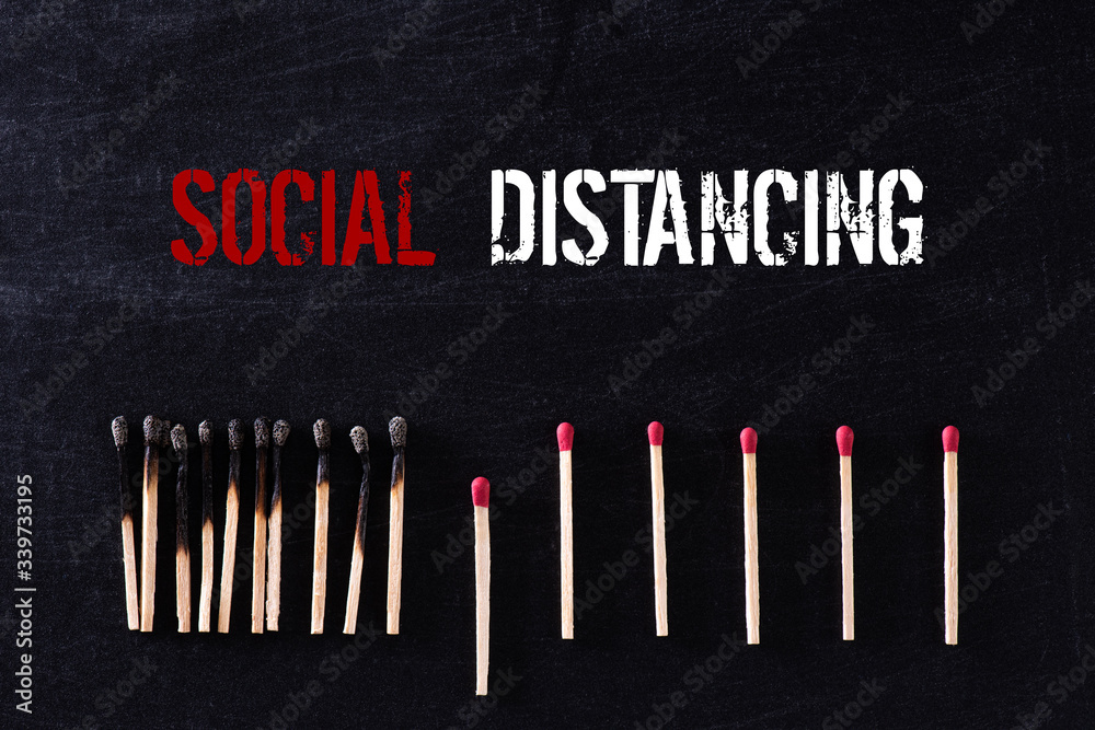 Social Distancing concept. Matchsticks burn, one piece prevents the ...