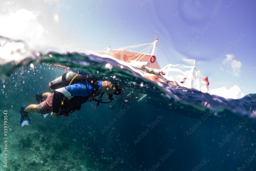 Scuba diver exploring Philippine dive sites in Moalboal. Stock Photo ...