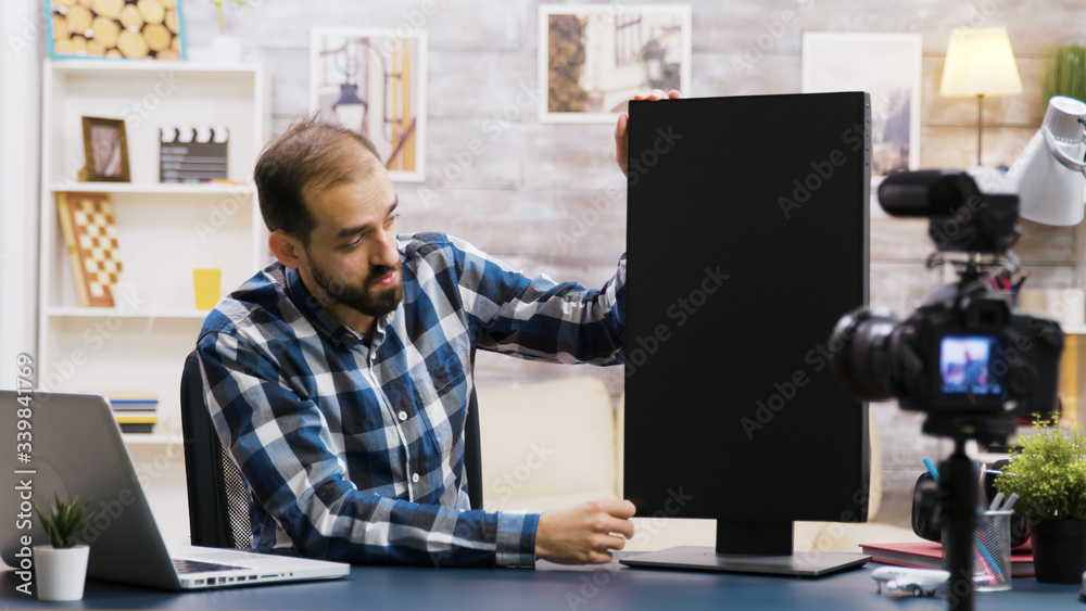 Famous vlogger filming lcd monitor review for his followers Stock Photo ...