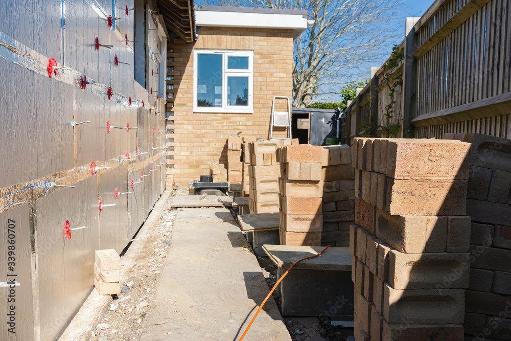 Preparation of the insulated wall for bricklaying in residential ...