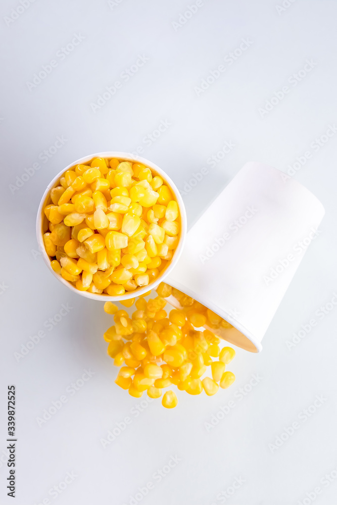 Boiled corn kernels in foam cup side view isolated on white background ...