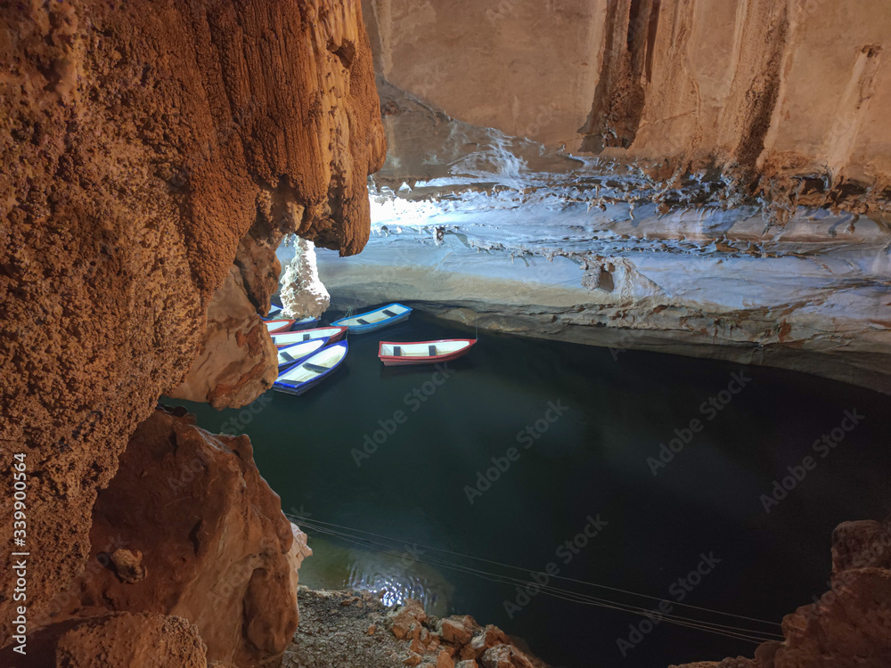 Big rude cave with lake. Boats on the lake in the cave top view. Stock ...