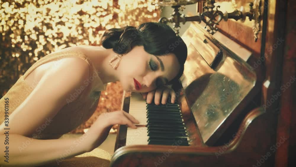 Beautiful sexy elegant romantic young retro woman. Gently touches key ...