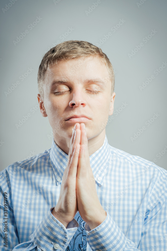 Closeup portrait of young man, open mouth, praying looking up hoping ...