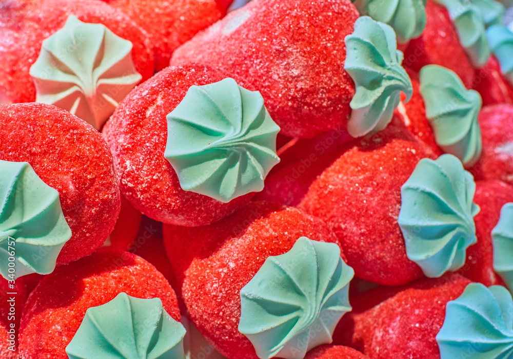 strawberries made of red and green candies and coated in sugar. Stock ...