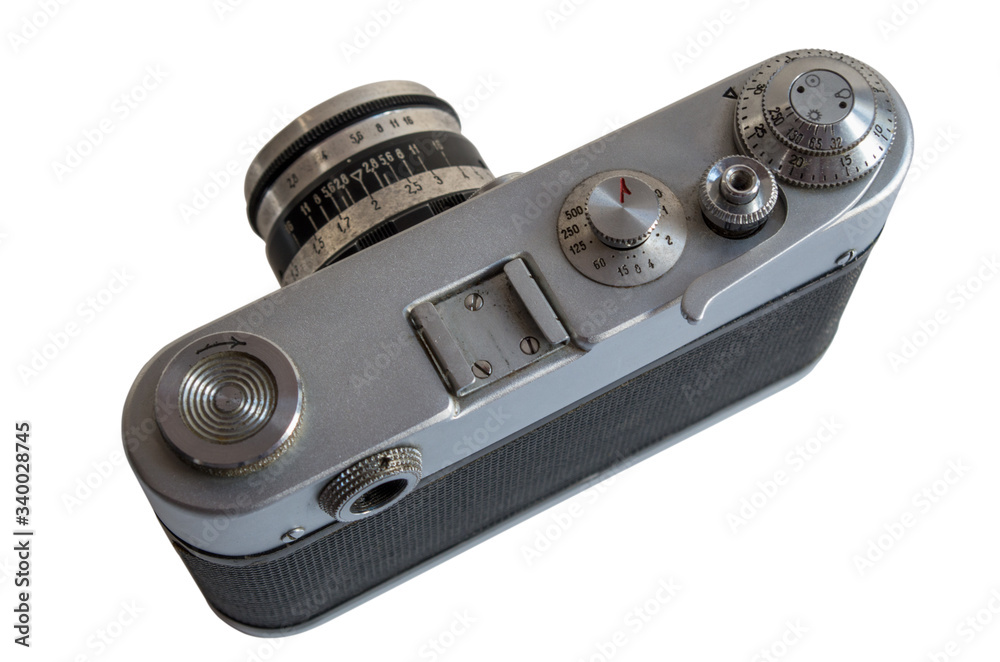 Old film camera with silver-black cast aluminum body with traces of use ...