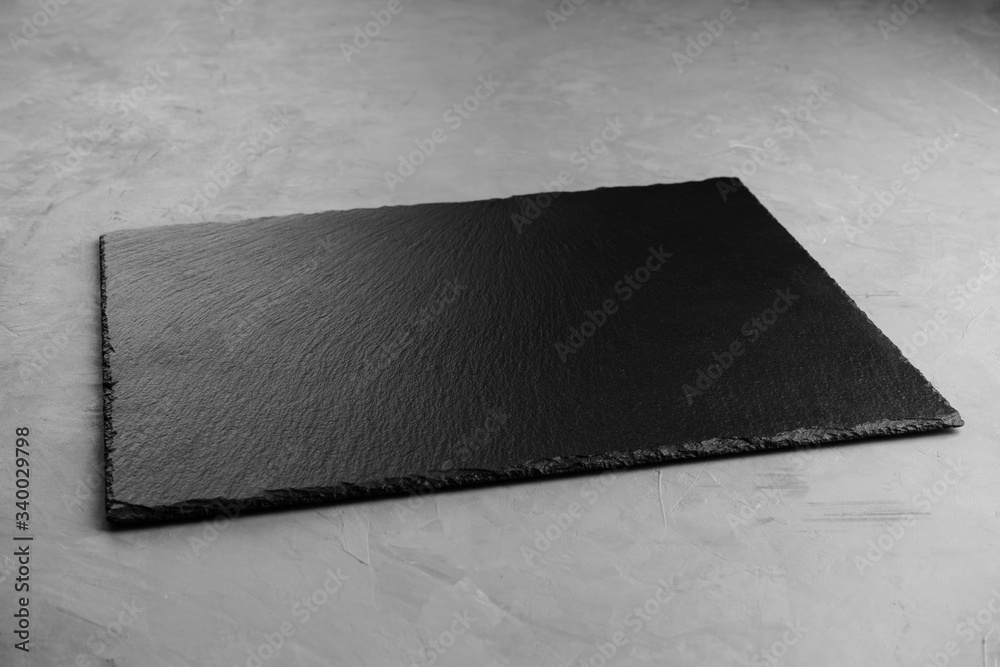 Slate Board on a grey background for product placement on the diagonal ...