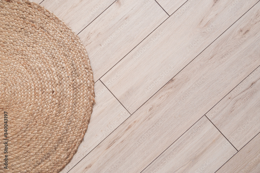 Laminate flooring panels with chamfer and wicker carpet. Top view ...