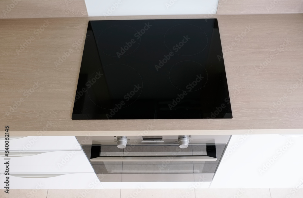 Top view of induction cooker hob on kitchen worktop Stock Photo | Adobe ...