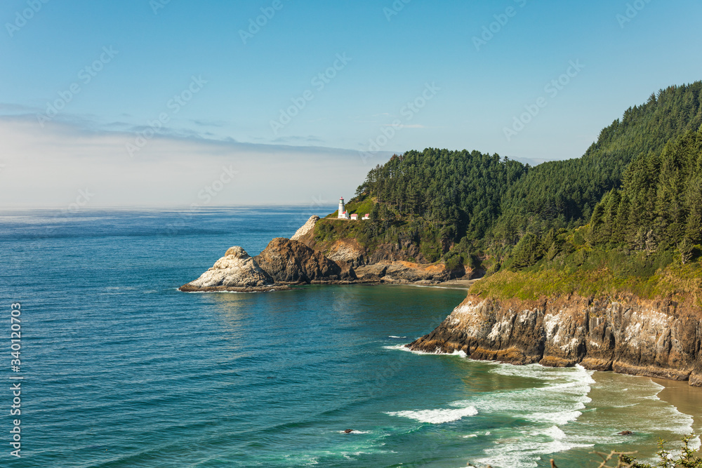 Beach and cliffs leading to Heceta Head Lighthouse as seen from ...