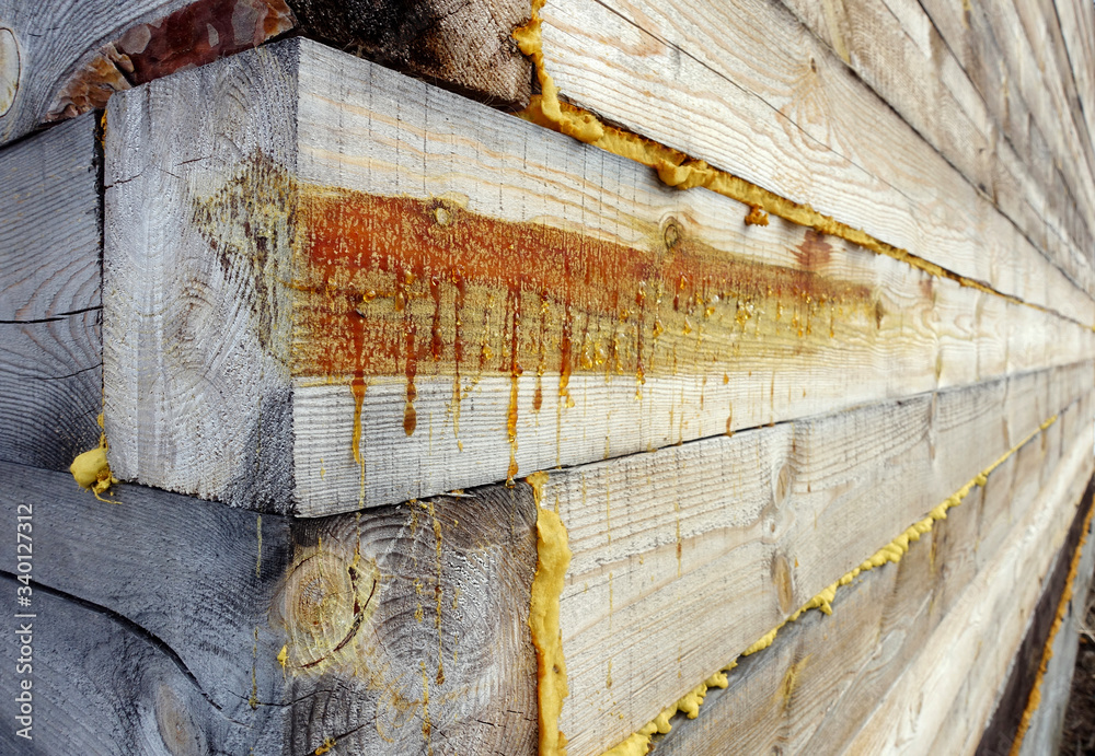 Corner of a log house close-up. Wooden structure, the joints of the ...